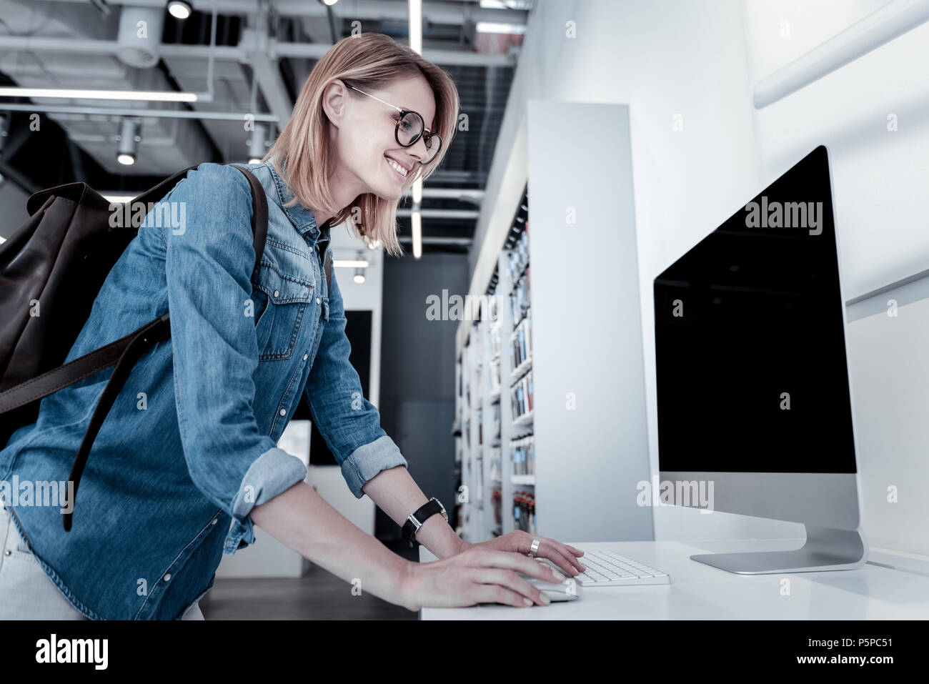 Happy customer testing a gorgeous modern computer Stock Photo - Alamy