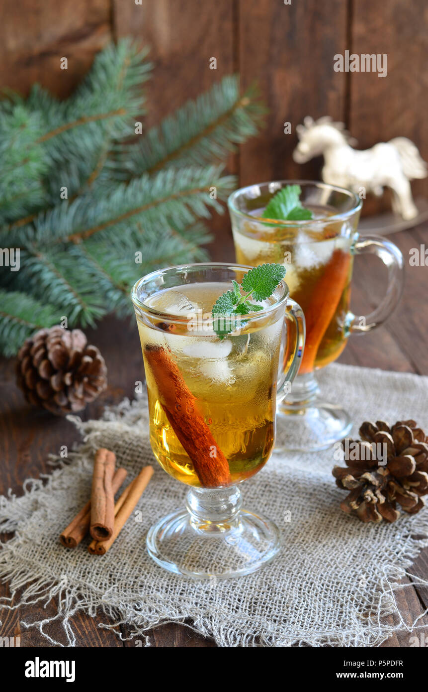 Whiskey cocktail with cinnamon on Christmas background Stock Photo - Alamy