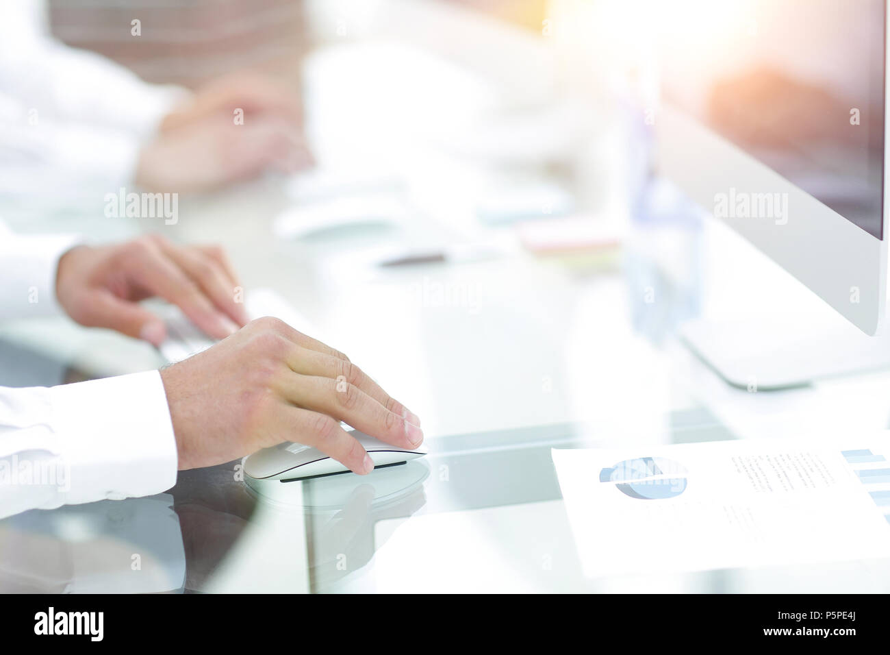 hands typing text on the computer keyboard. blurred business background ...