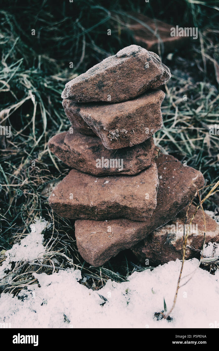 Stones placed one on top of the other frozen by the cold of winter ...