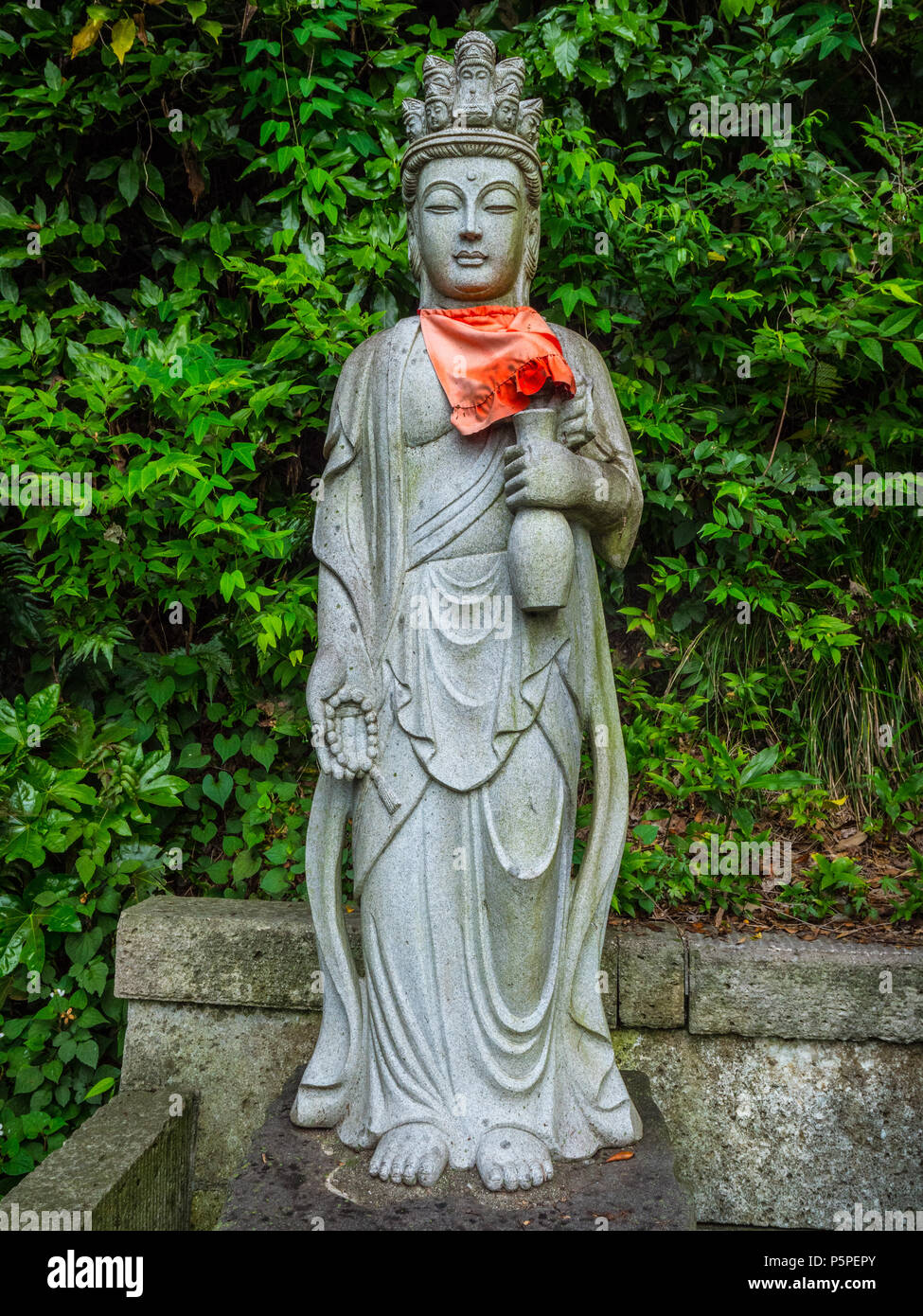 Small statue in a Japanese garden in Ofuna Stock Photo - Alamy