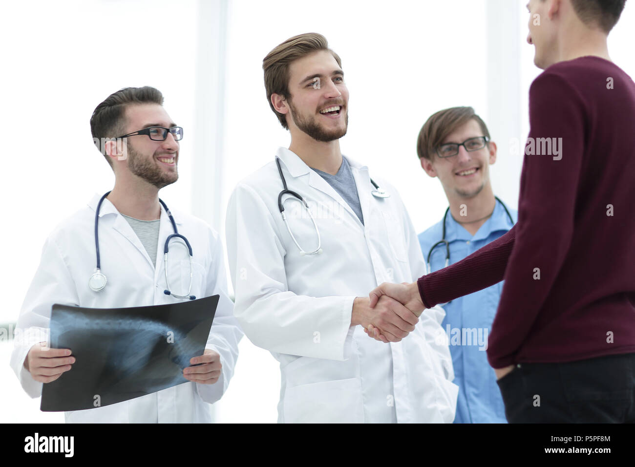 Doctor business man shake hands hi-res stock photography and images - Alamy