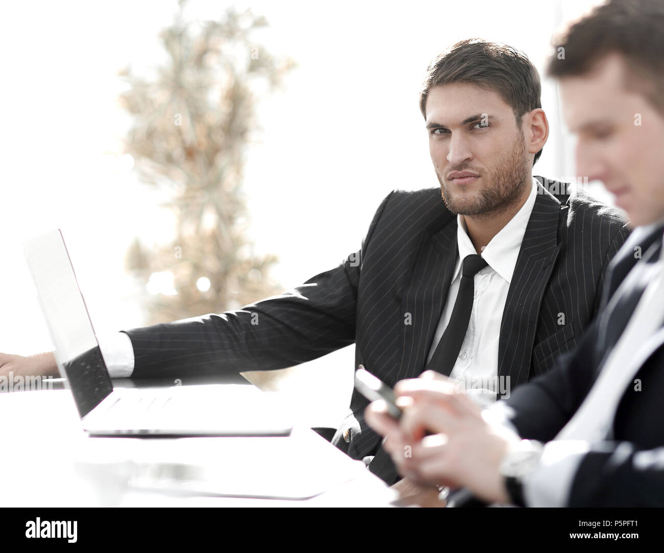 Boss sitting behind desk hi-res stock photography and images - Alamy