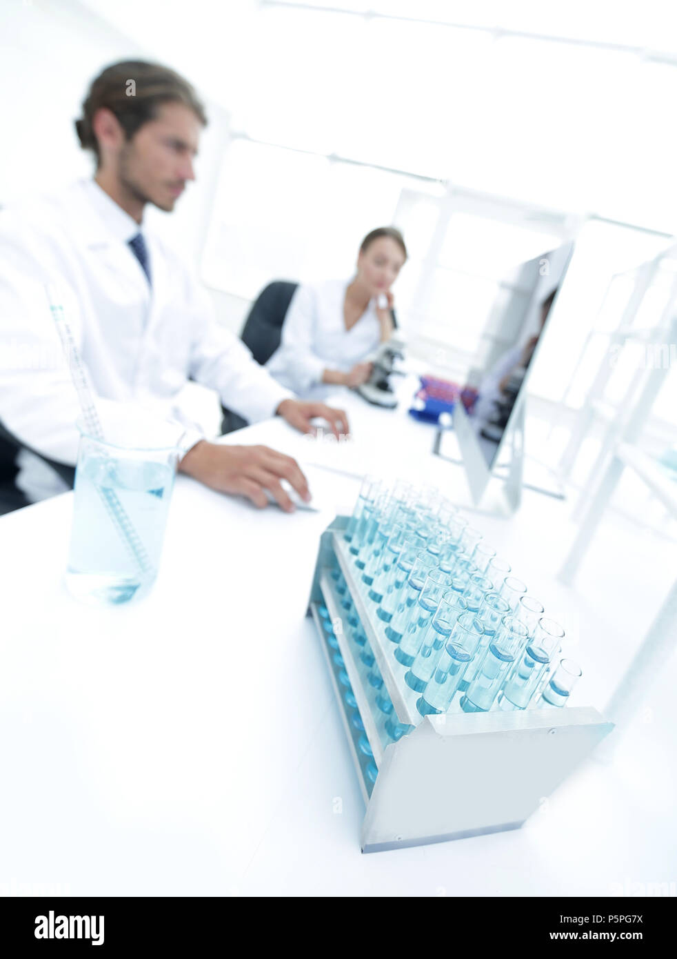side view of scientists working in laboratory Stock Photo - Alamy