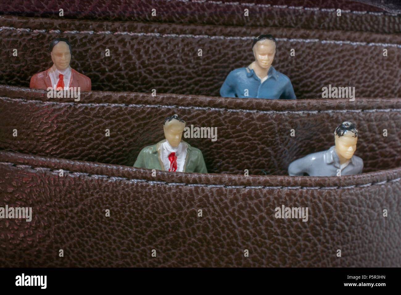 Tiny figurine of group of men miniature model in pockets Stock Photo ...