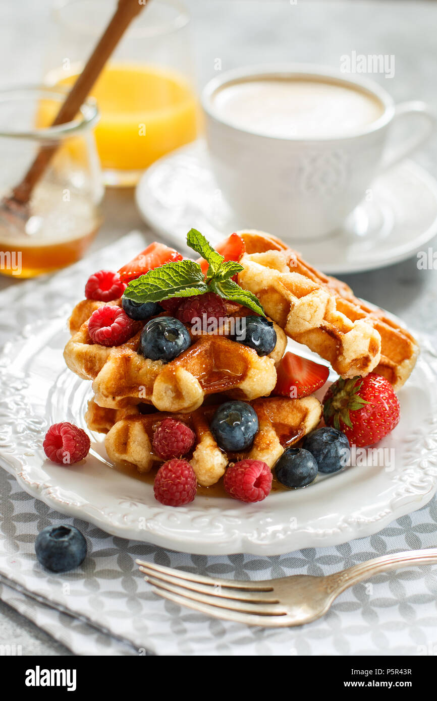 Fresh homemade waffles with raspberries, strawberries, blueberries and ...