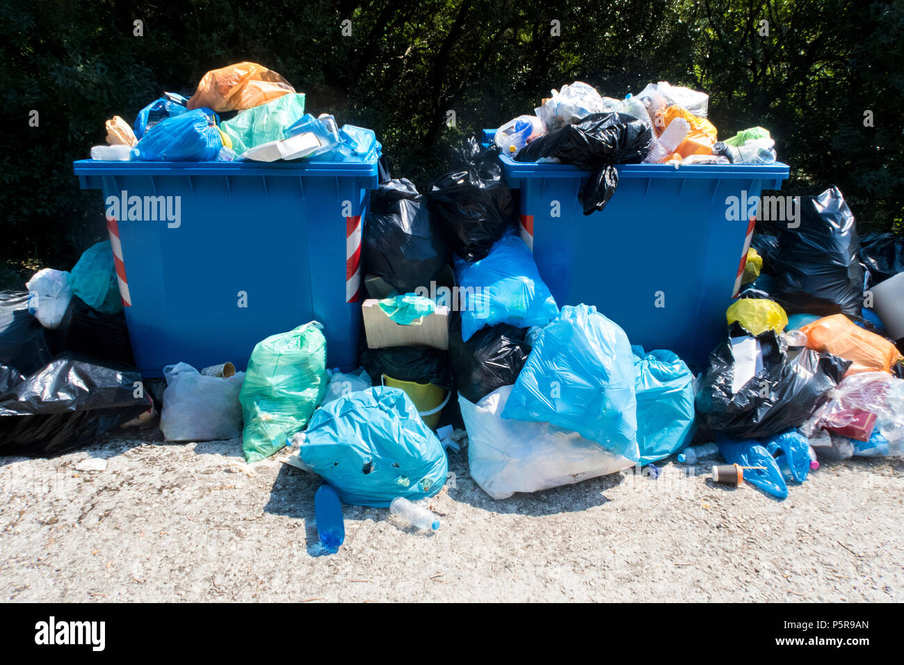 Overflowing bin hi-res stock photography and images - Alamy