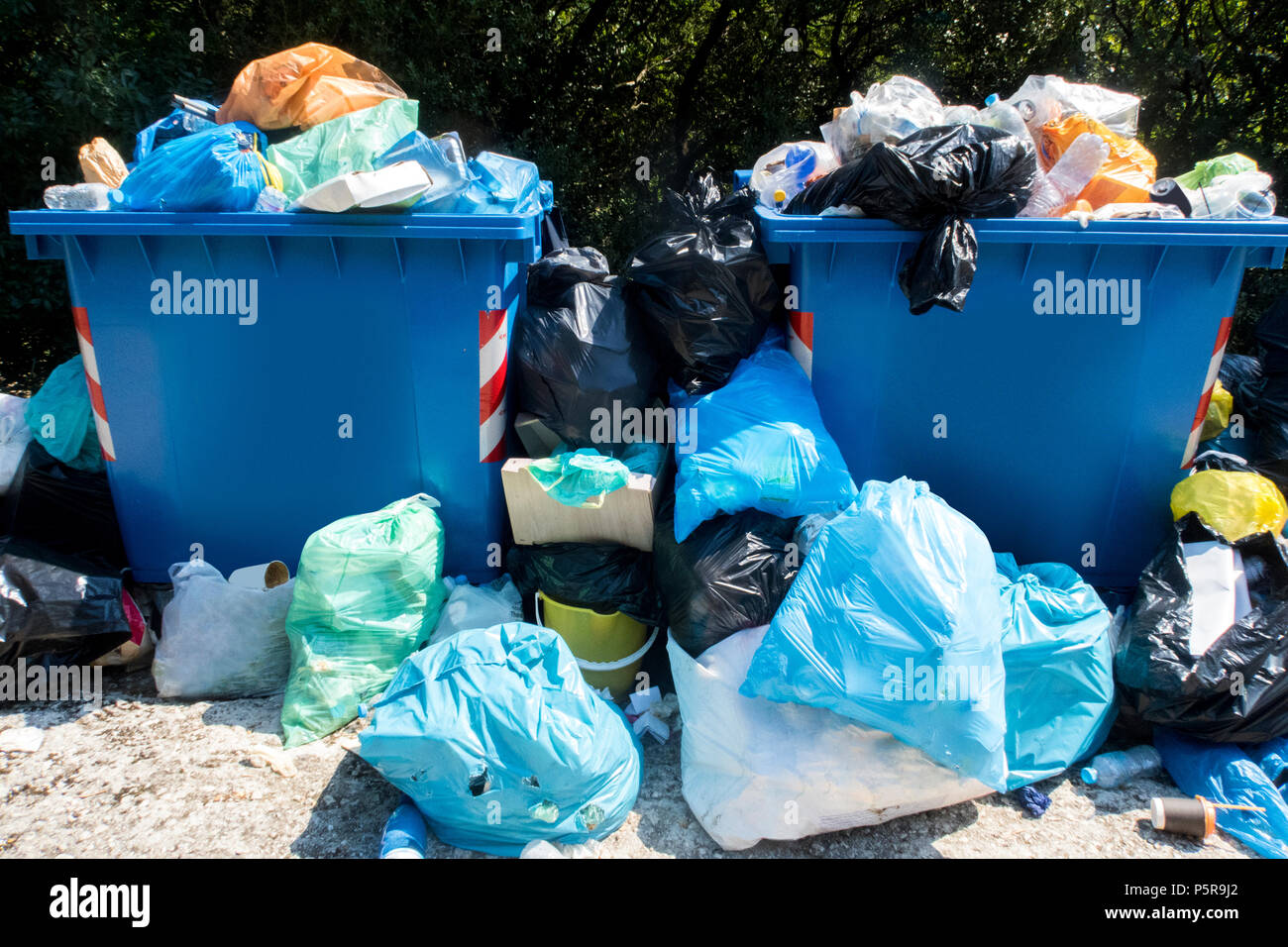 Overflowing Waste Collection Bins Outdoors Stock Photo - Alamy