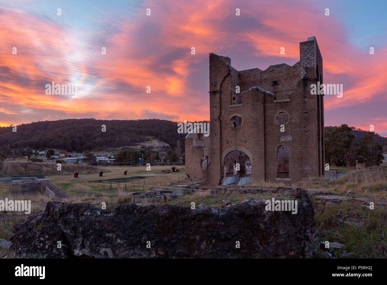 A sunrise over the iconic Lithgow Ironworks blast furnace in the blue ...