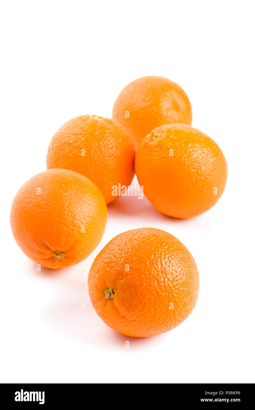 five fresh oranges on white background Stock Photo - Alamy
