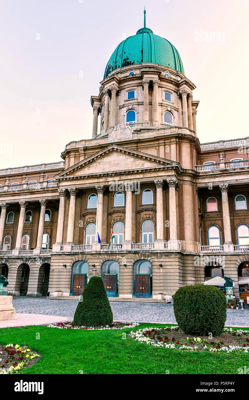 Buda Castle main entrance at sunset. Warm cloudy sky on background ...