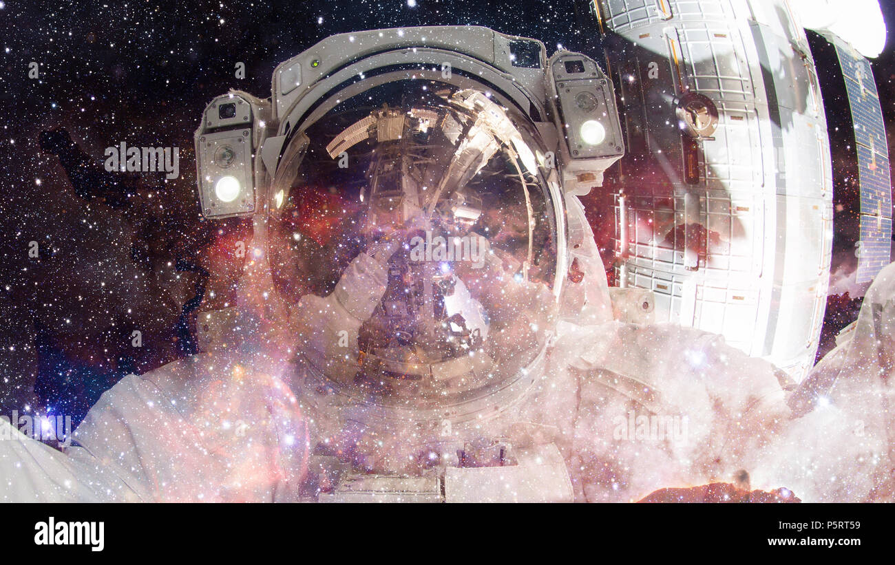 Astronaut in outer space. Science fiction art. Elements of this image ...
