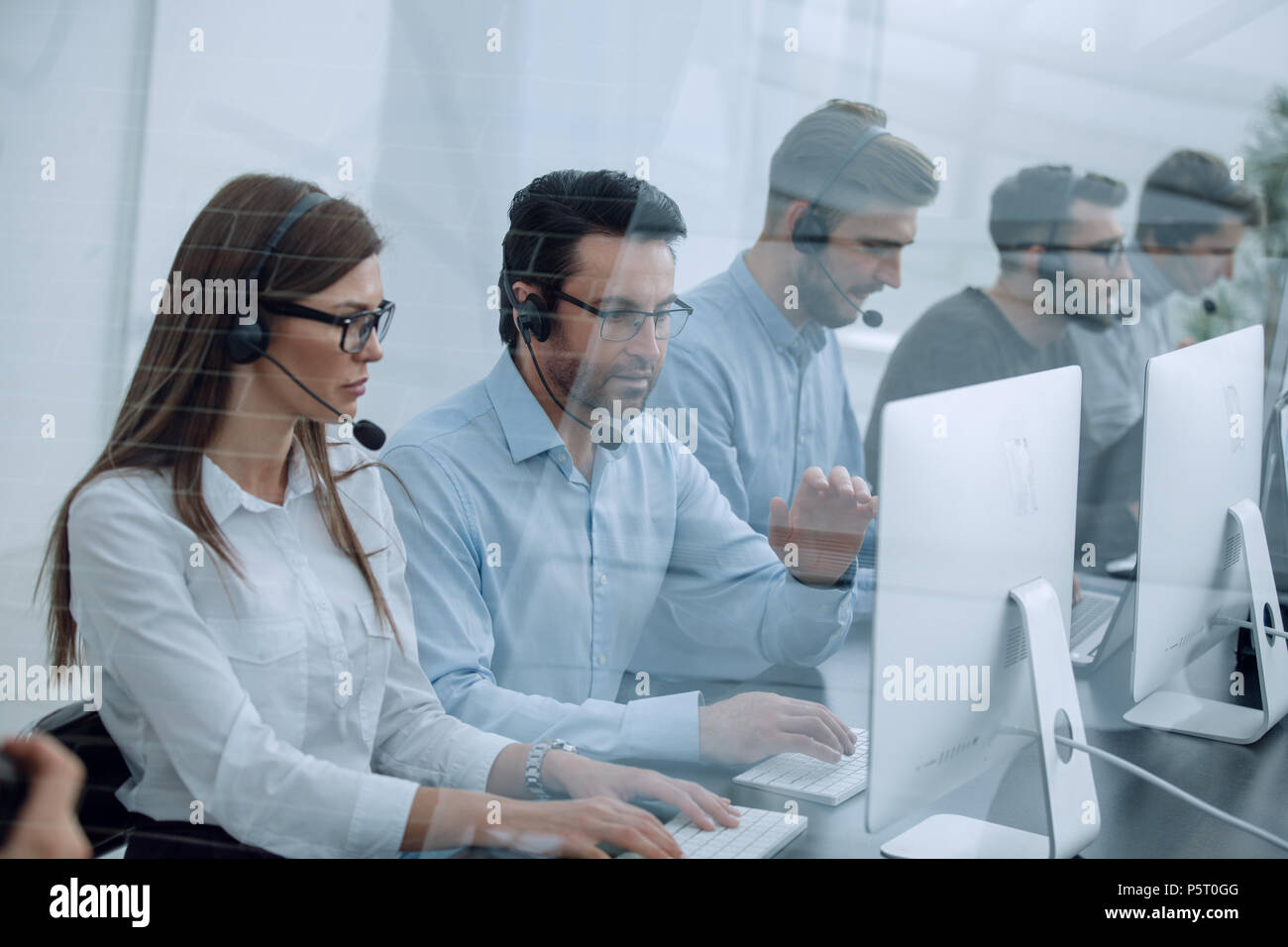 call center staff at the workplace in the office Stock Photo - Alamy