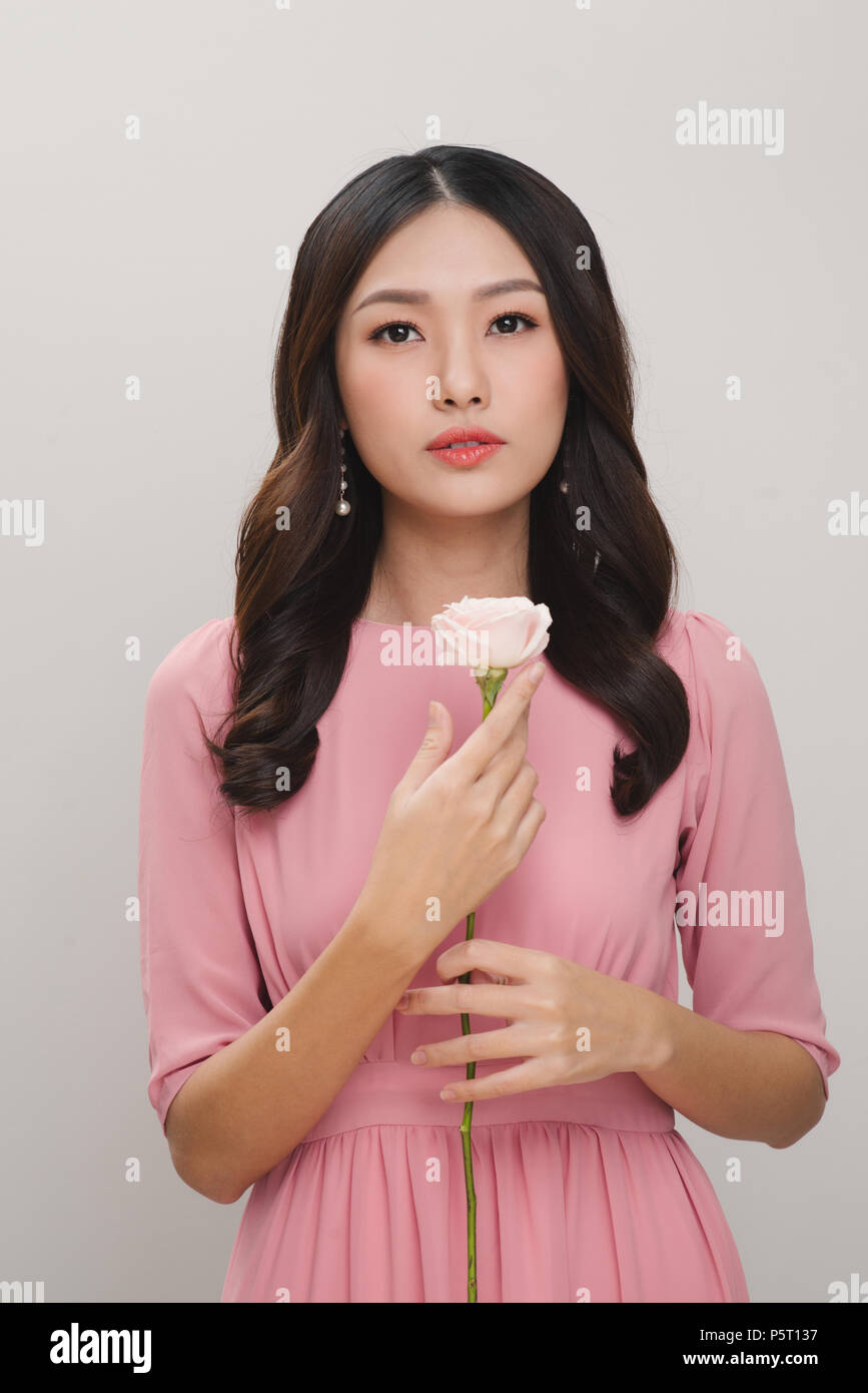 Woman with red rose hi-res stock photography and images - Alamy