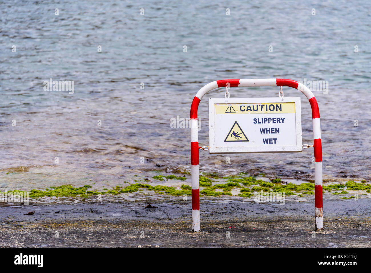 Slippery when wet sign hi-res stock photography and images - Alamy