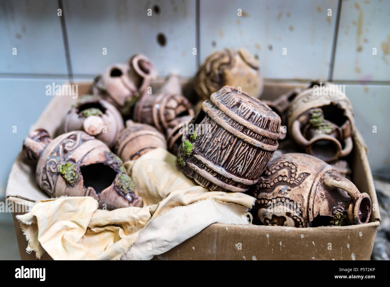 Various clay items in box. Pottery workshop Stock Photo - Alamy