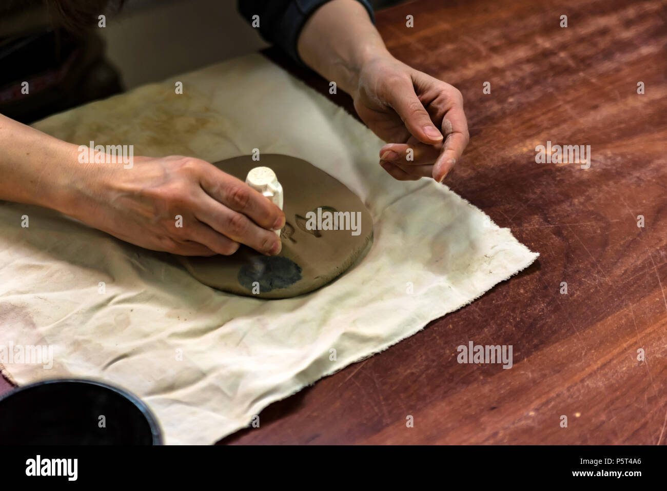 Pressing the clay hi-res stock photography and images - Alamy