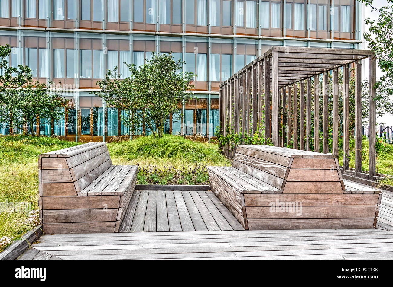 Rotterdam, The Netherlands, June 16, 2018: wooden benches, platform and ...