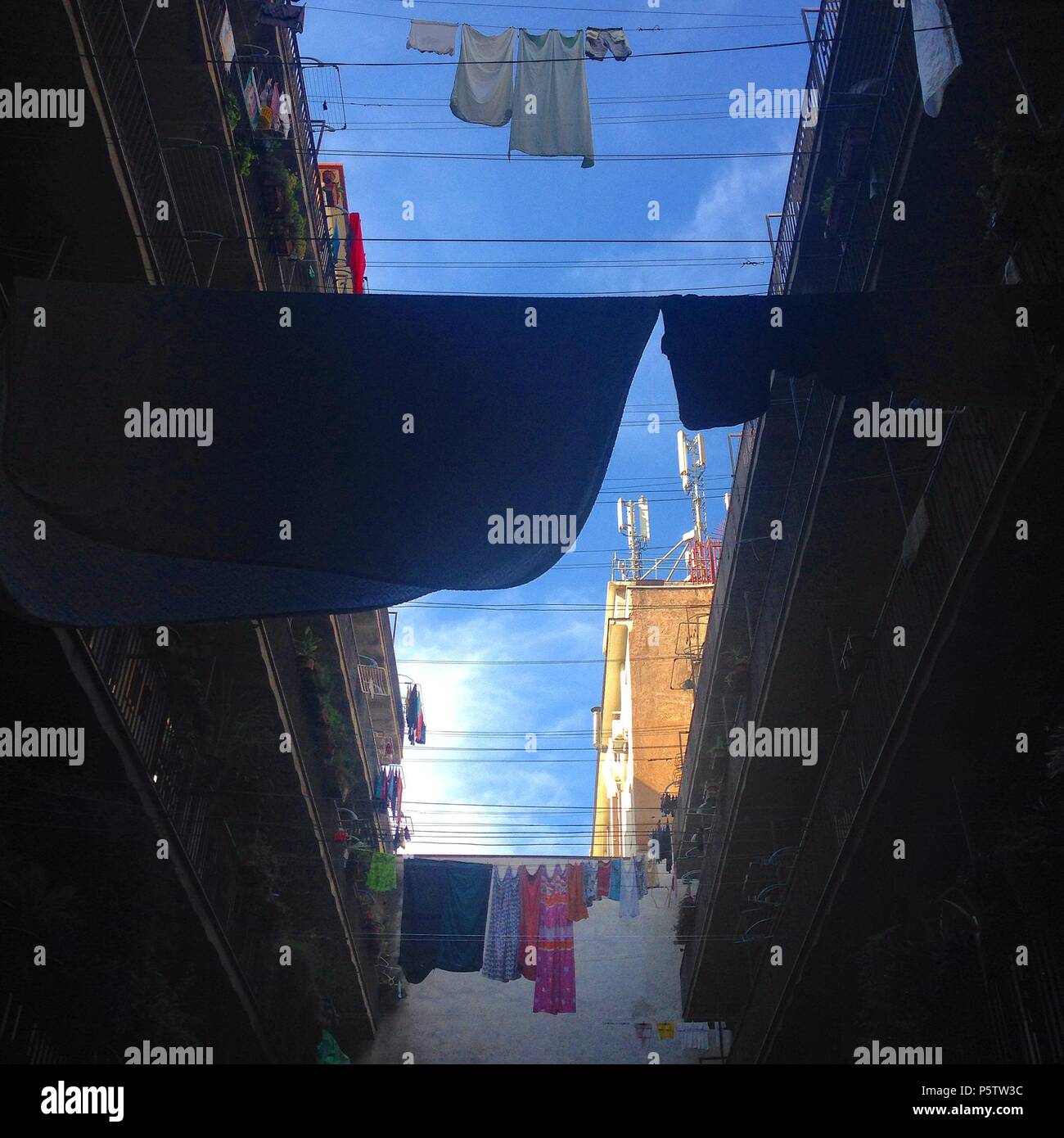 Laundry drying on the line in a street of San Lorenzo district in Rome ...