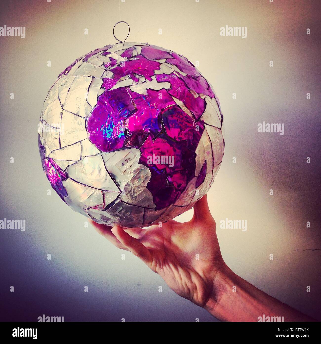 Hand globe sculpture hi-res stock photography and images - Alamy