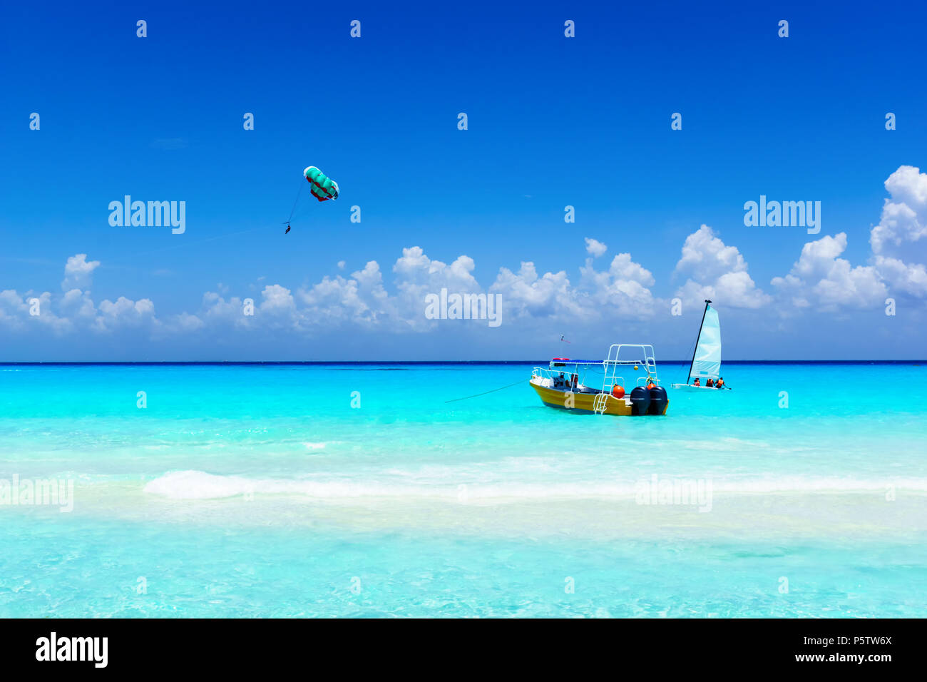 Flying parasailing in a blue sky Watersport concept Stock Photo - Alamy