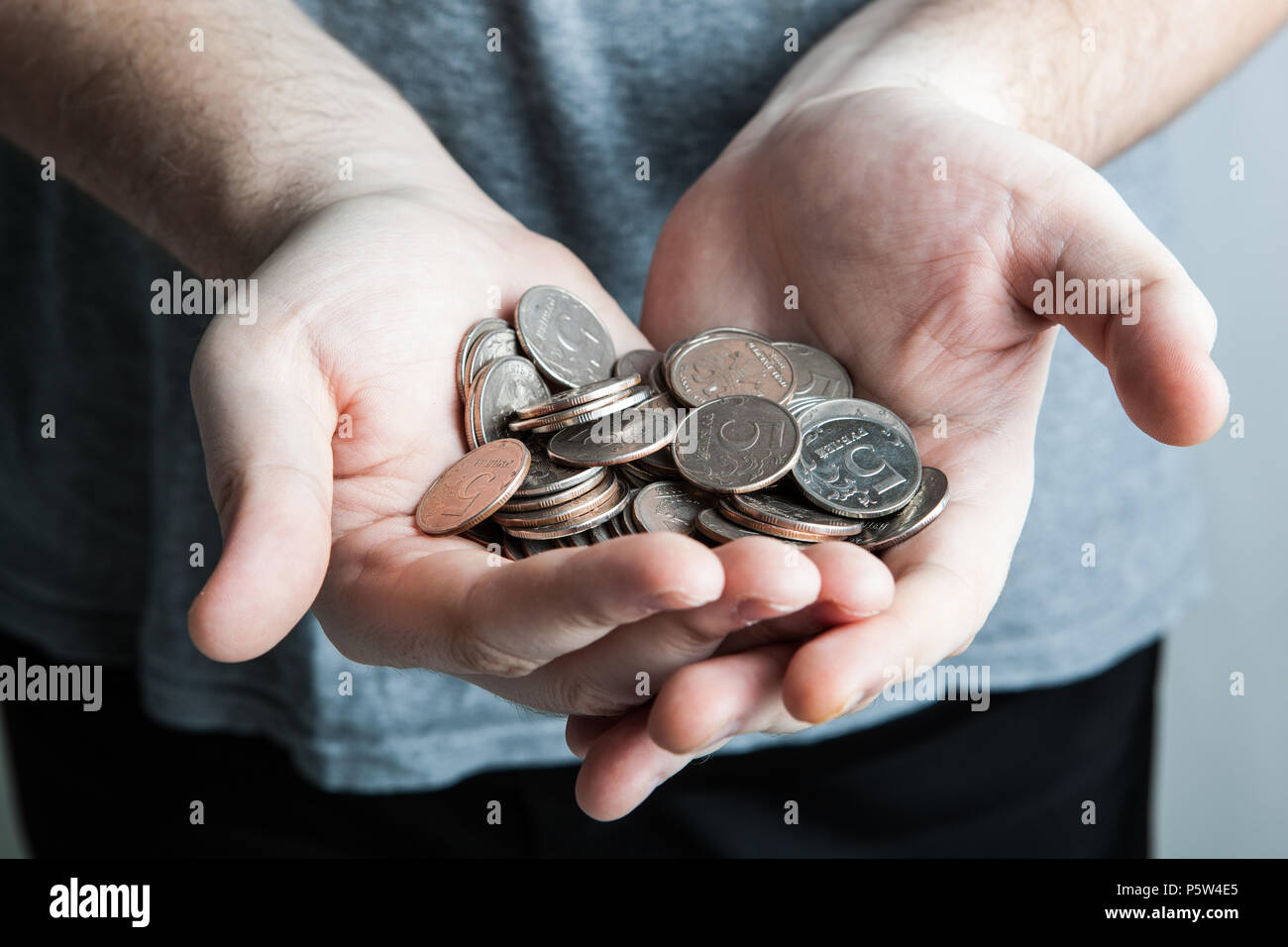 five-ruble coin in man's hands close up Stock Photo - Alamy