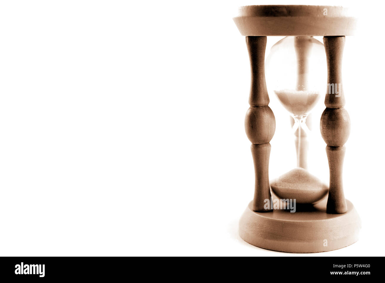 sand clock showing how is time passing on white background Stock Photo ...