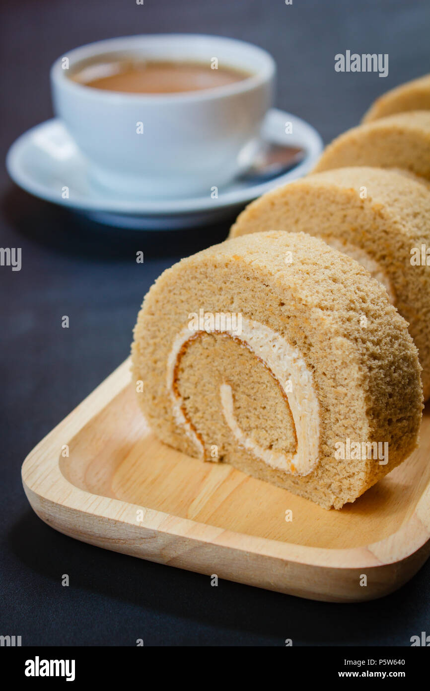 Roll small cake coffee with cream, coffee break time Stock Photo - Alamy