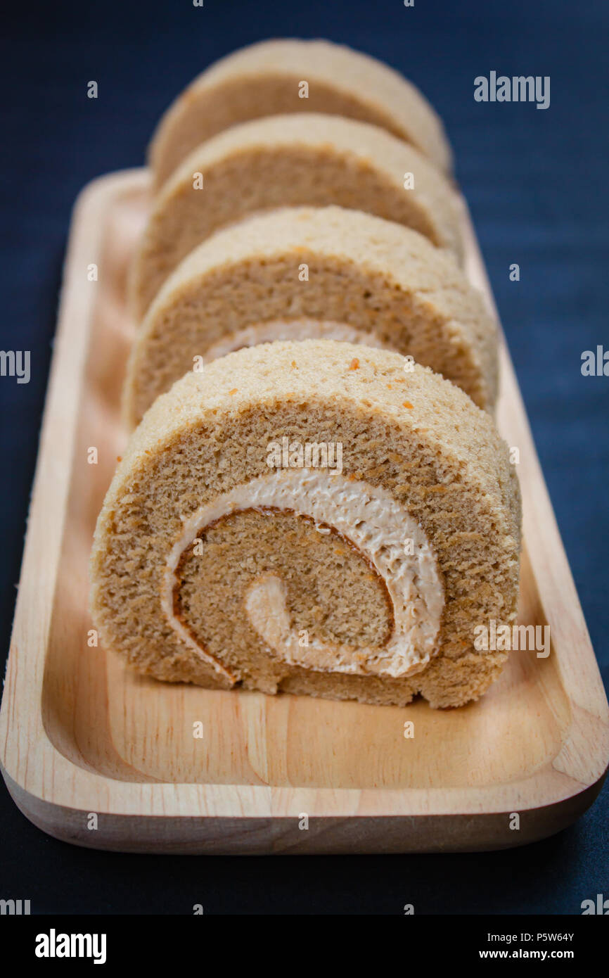 Roll small cake coffee with cream, coffee break time Stock Photo - Alamy