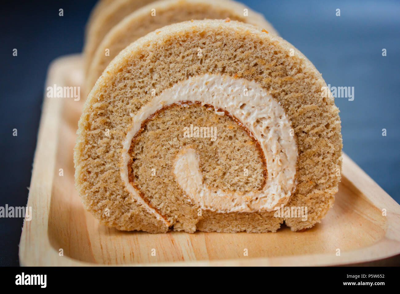 Roll small cake coffee with cream, coffee break time Stock Photo - Alamy