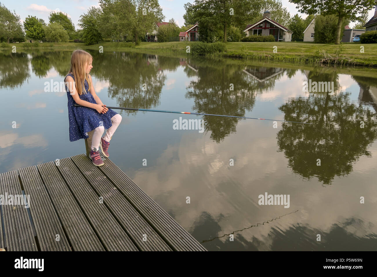Girl With Rod And Small Fish High Resolution Stock Photography and ...