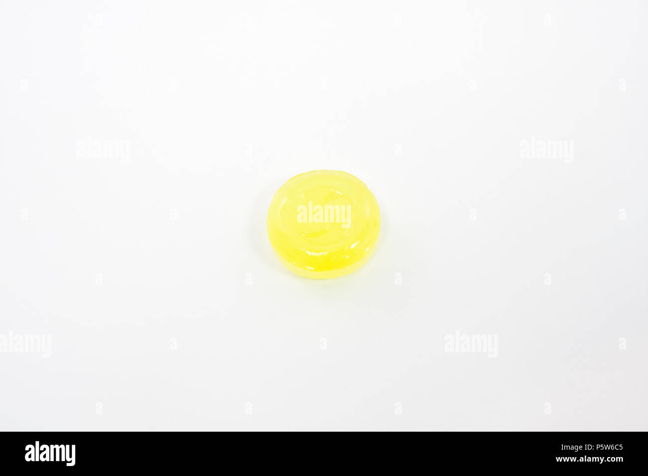 yellow cough sweets isolated on white background Stock Photo - Alamy