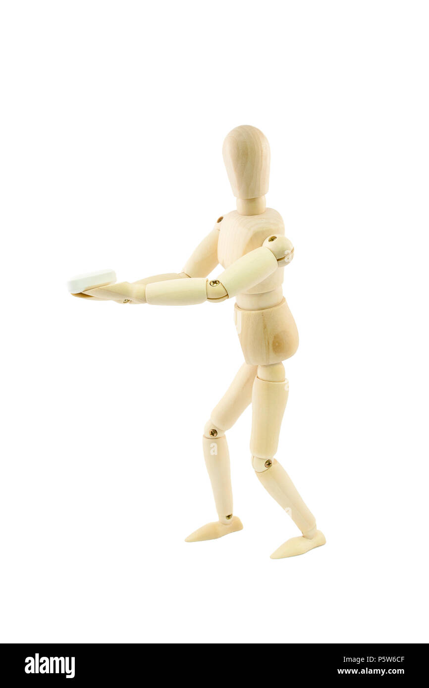 articulated wooden dummy giving a pill, isolated on white background ...