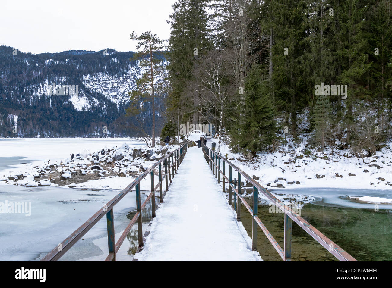 bridge over the lake eibsee in winter in Germany Stock Photo - Alamy