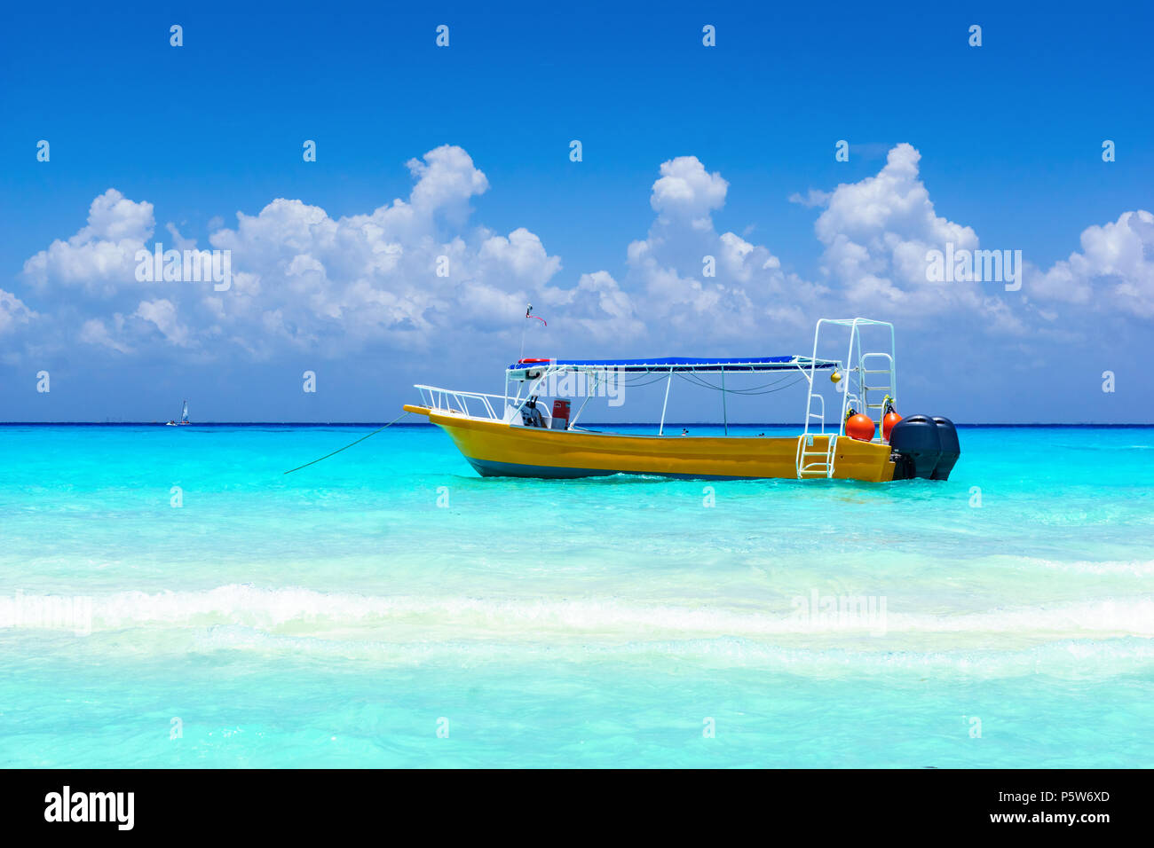 Yellow boat on a tropical beach Stock Photo - Alamy