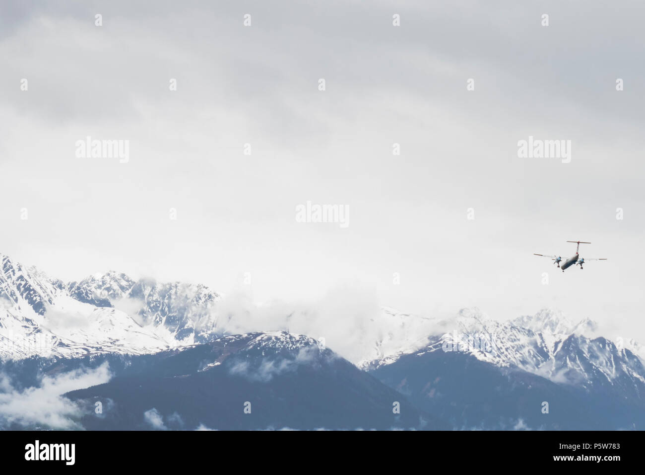 Aeroplane flying over mountain peak hi-res stock photography and images ...
