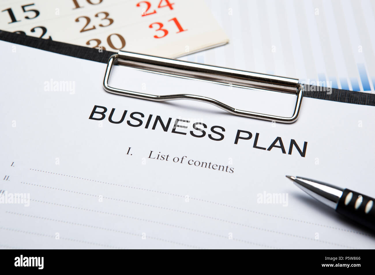Document with title business plan and office supplies Stock Photo - Alamy
