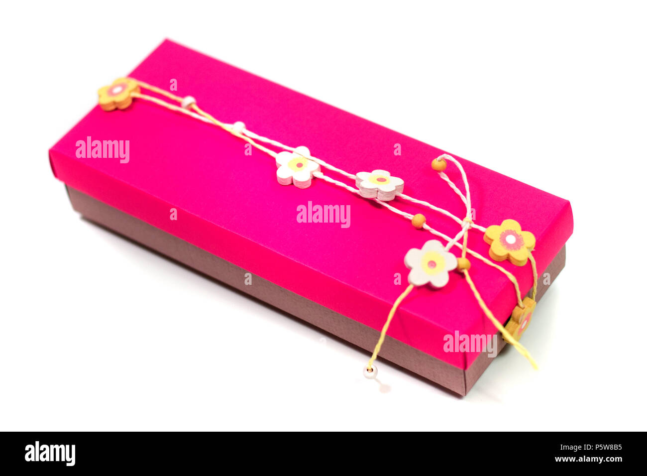 pink gift box with decoration on white background Stock Photo - Alamy
