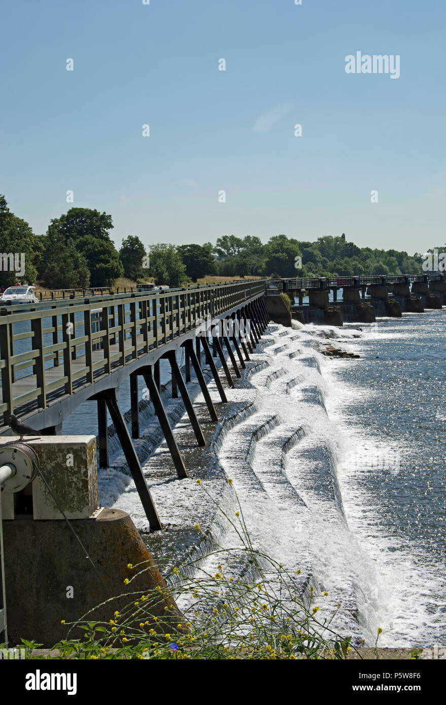 view across teddington lock weir, on the river thames in southwest ...