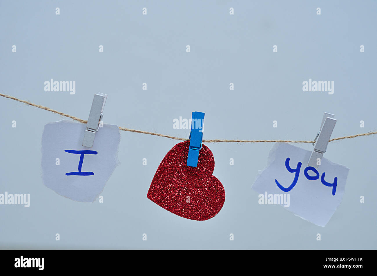 I love you hanging on a rope where love is replaced with a red heart ...