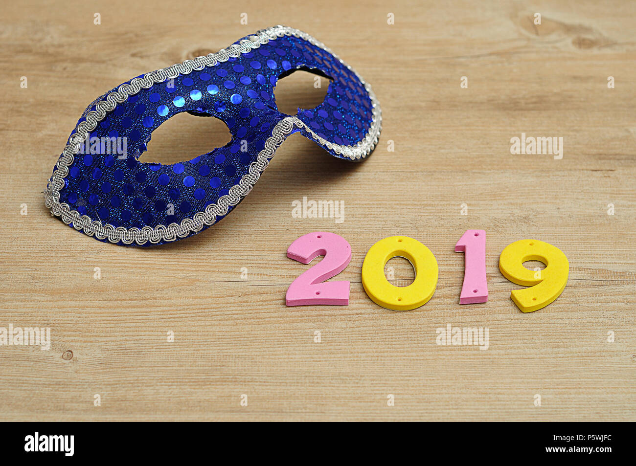 A blue masquerade mask with 2019 in colorful numbers Stock Photo - Alamy