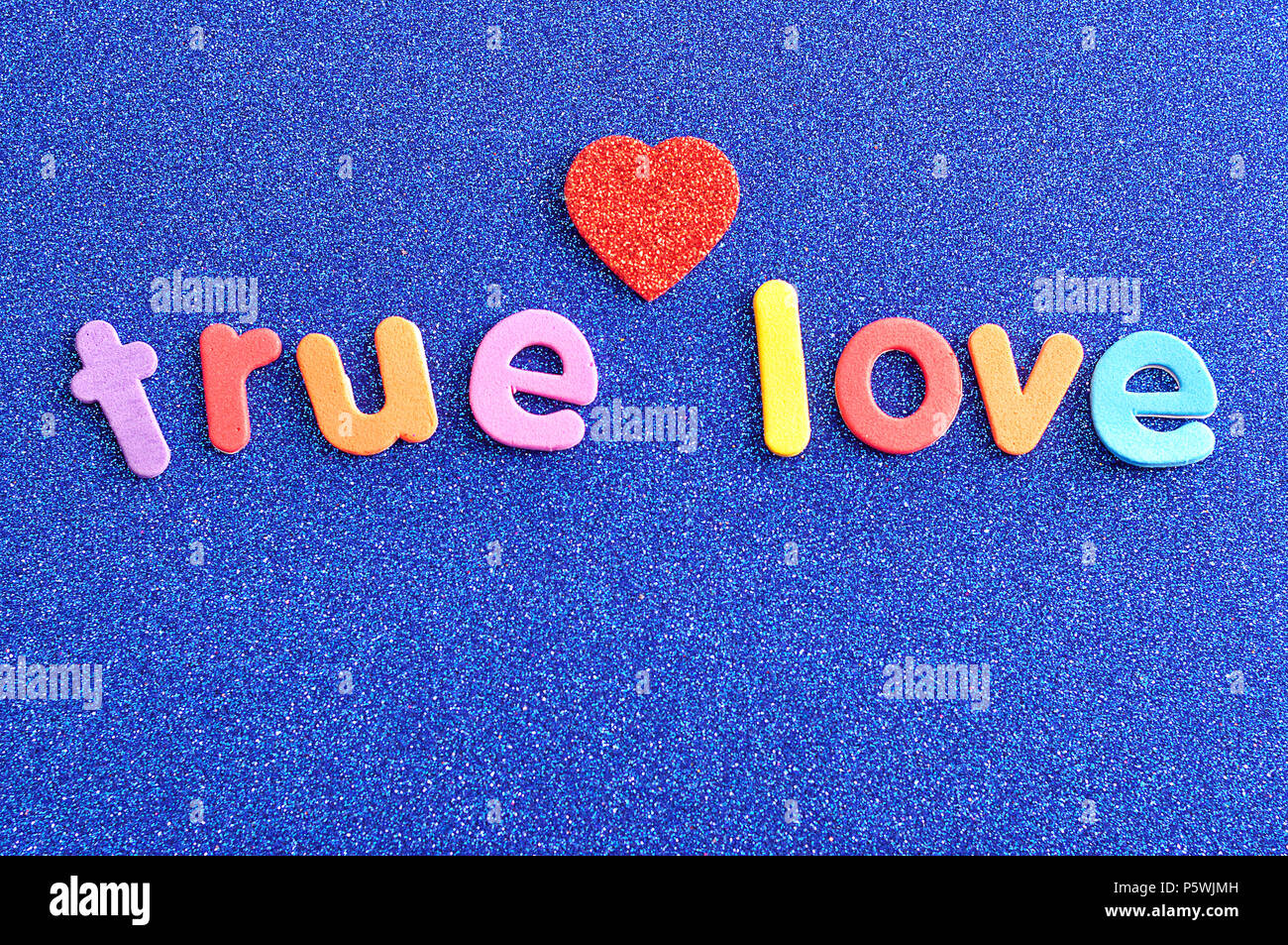 The words true love in colorful letters on a blue background with a red ...