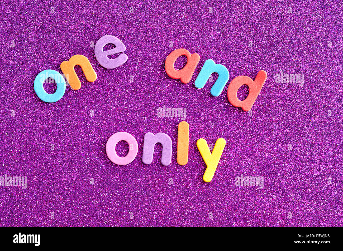 The words one and only in colorful letters on a purple background Stock ...