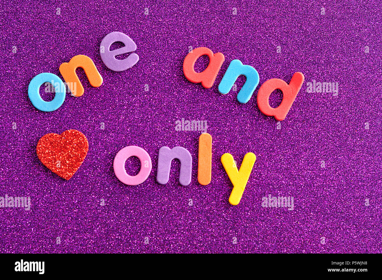 The words one and only in colorful letters on a purple background with ...