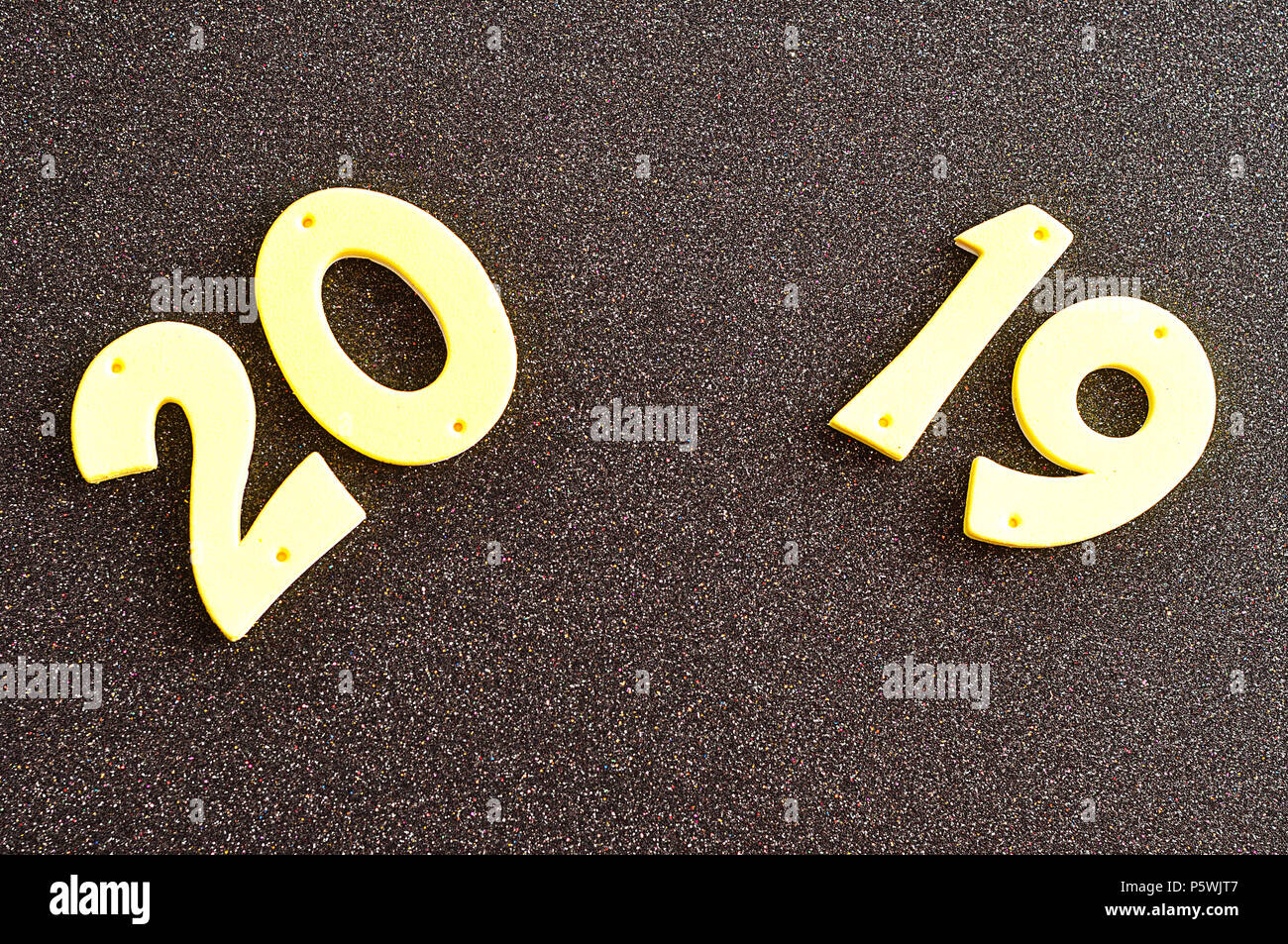 2019 in yellow numbers on a black background Stock Photo - Alamy