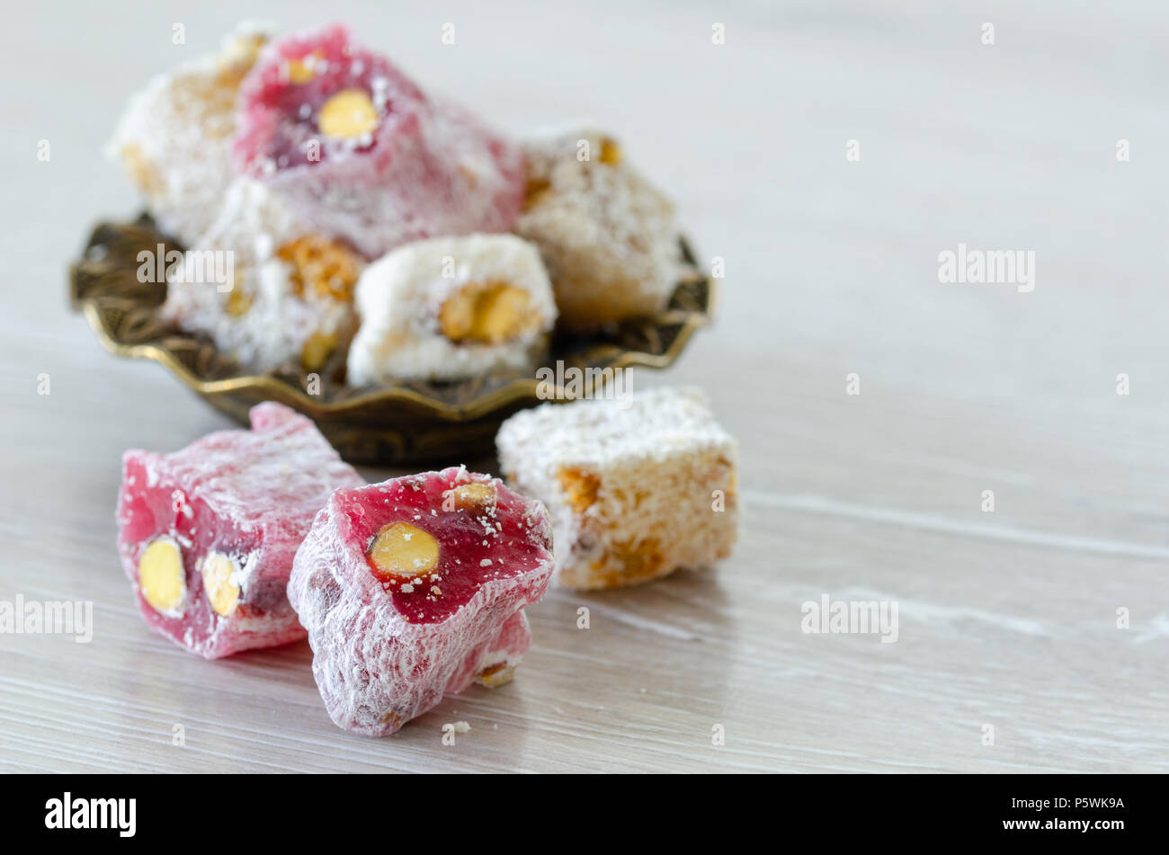 Turkish delight with pistachio nuts in traditional carved patterned ...