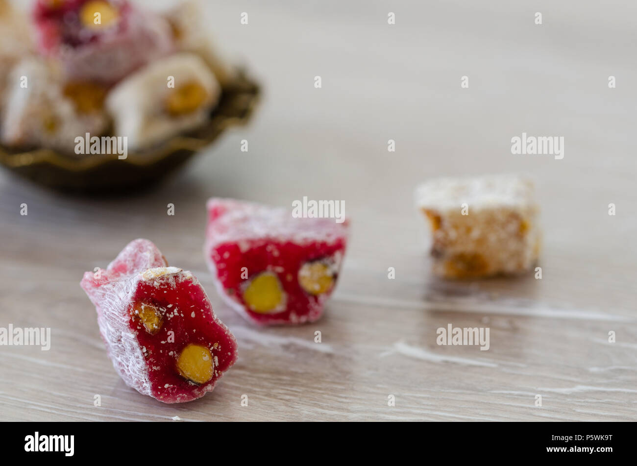 Turkish delight with pistachio nuts in traditional carved patterned ...