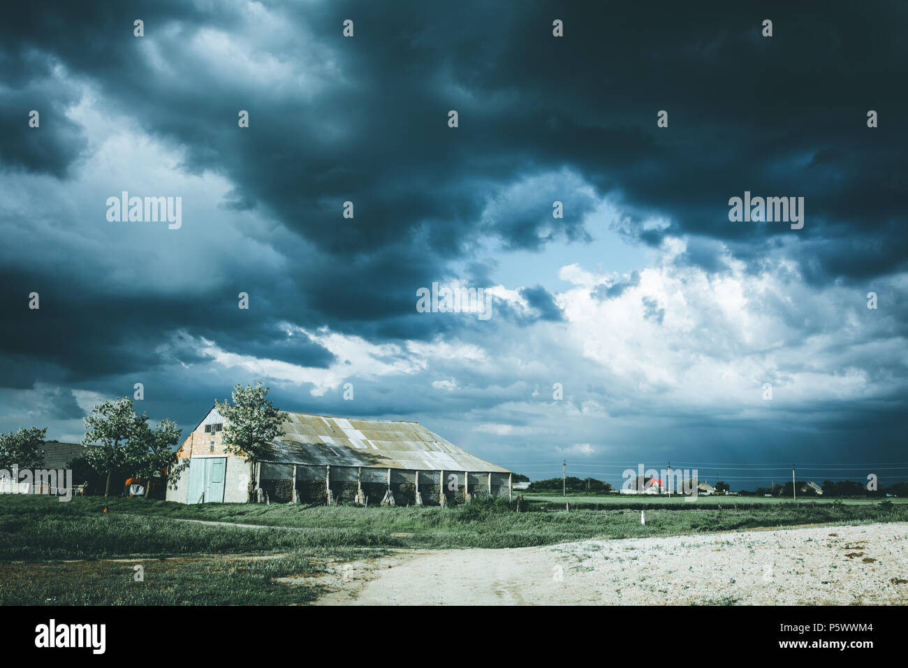 Gloomy thunderous rural landscape. Moody effect Stock Photo - Alamy
