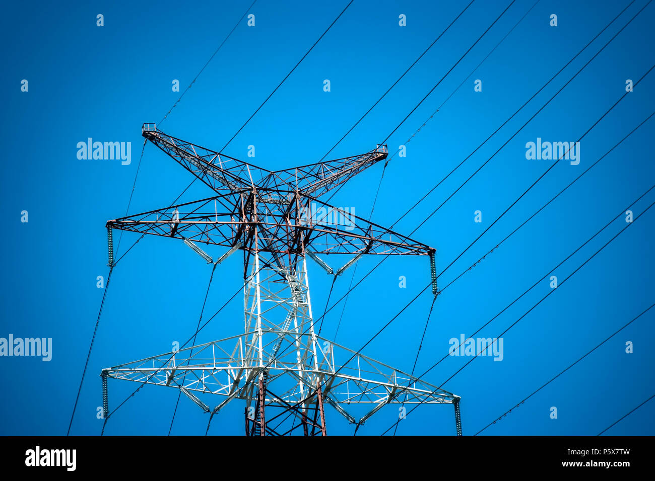 an image of a metal tower of Power Lines Stock Photo - Alamy