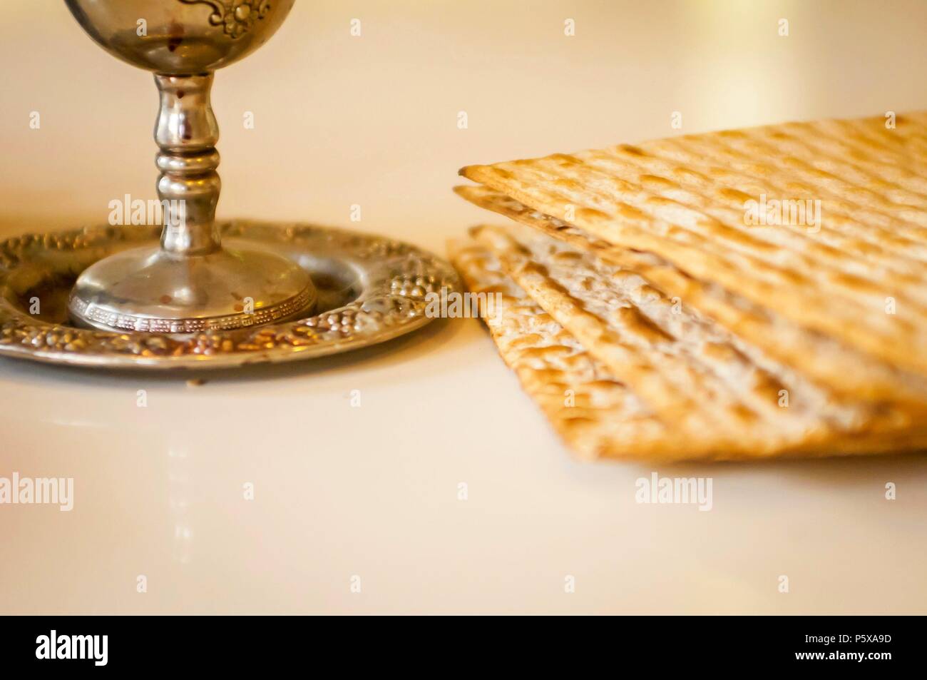 Jewish Passover concept illustration with matzah. Silver wine cup with ...